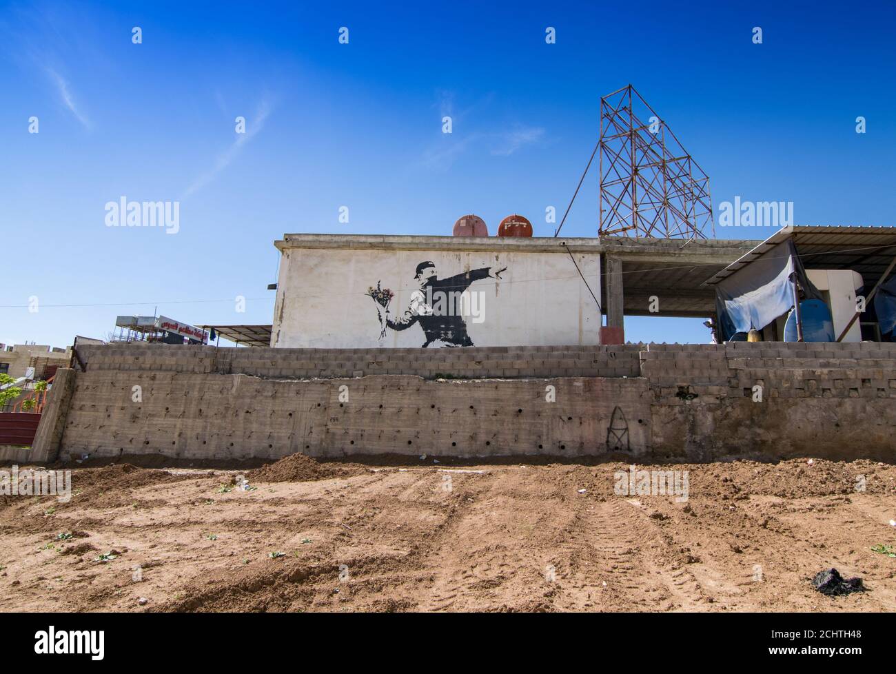 Banksy's famous mural "Rage, The Flower Thrower (Love Is In The Air ...