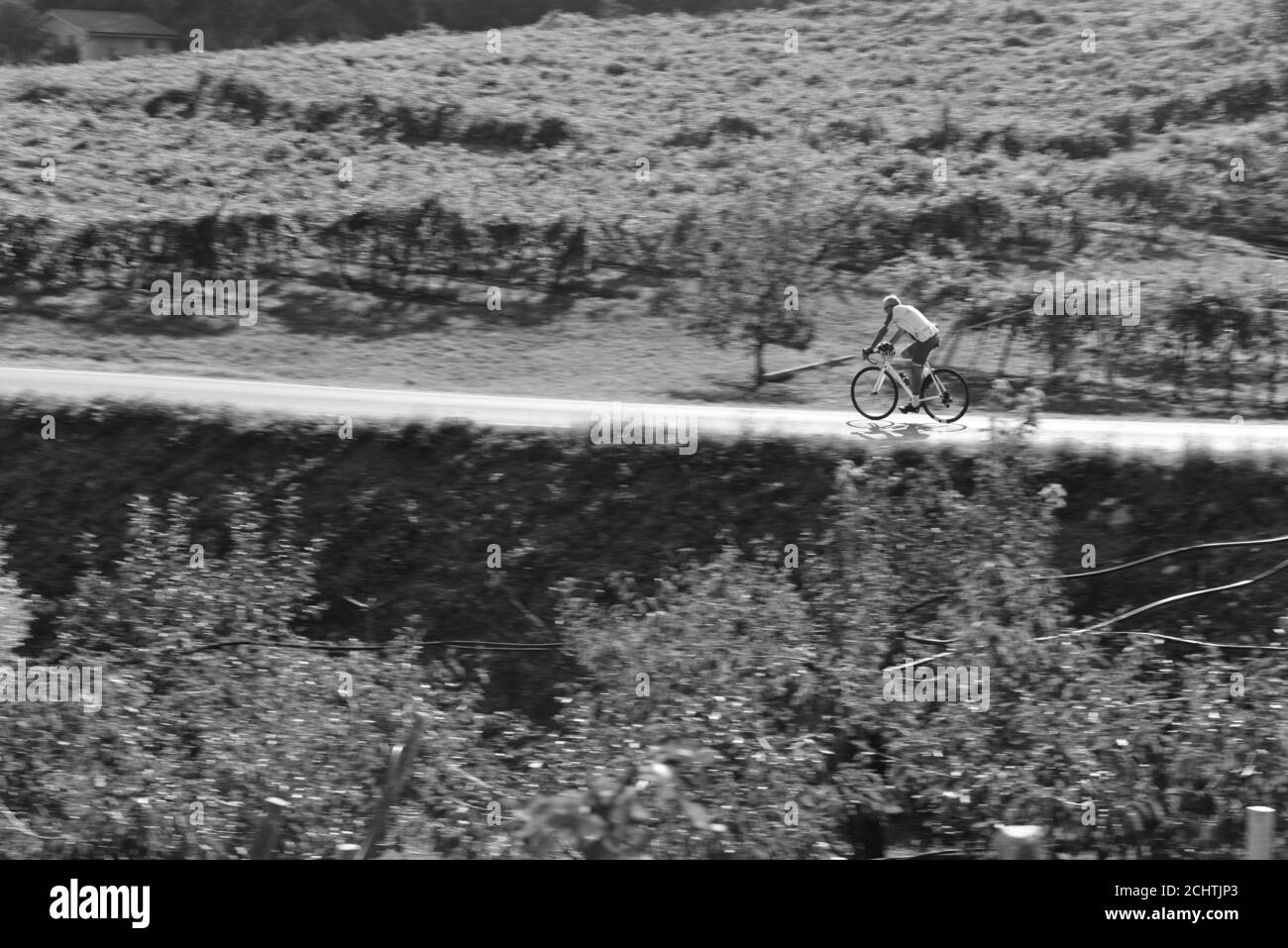 Lonely cyclist hi-res stock photography and images - Alamy