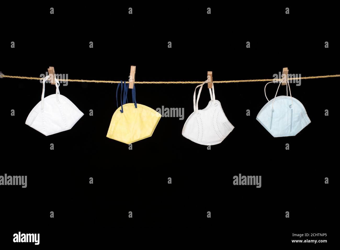 Face masks hanging on clothesline hi-res stock photography and images ...