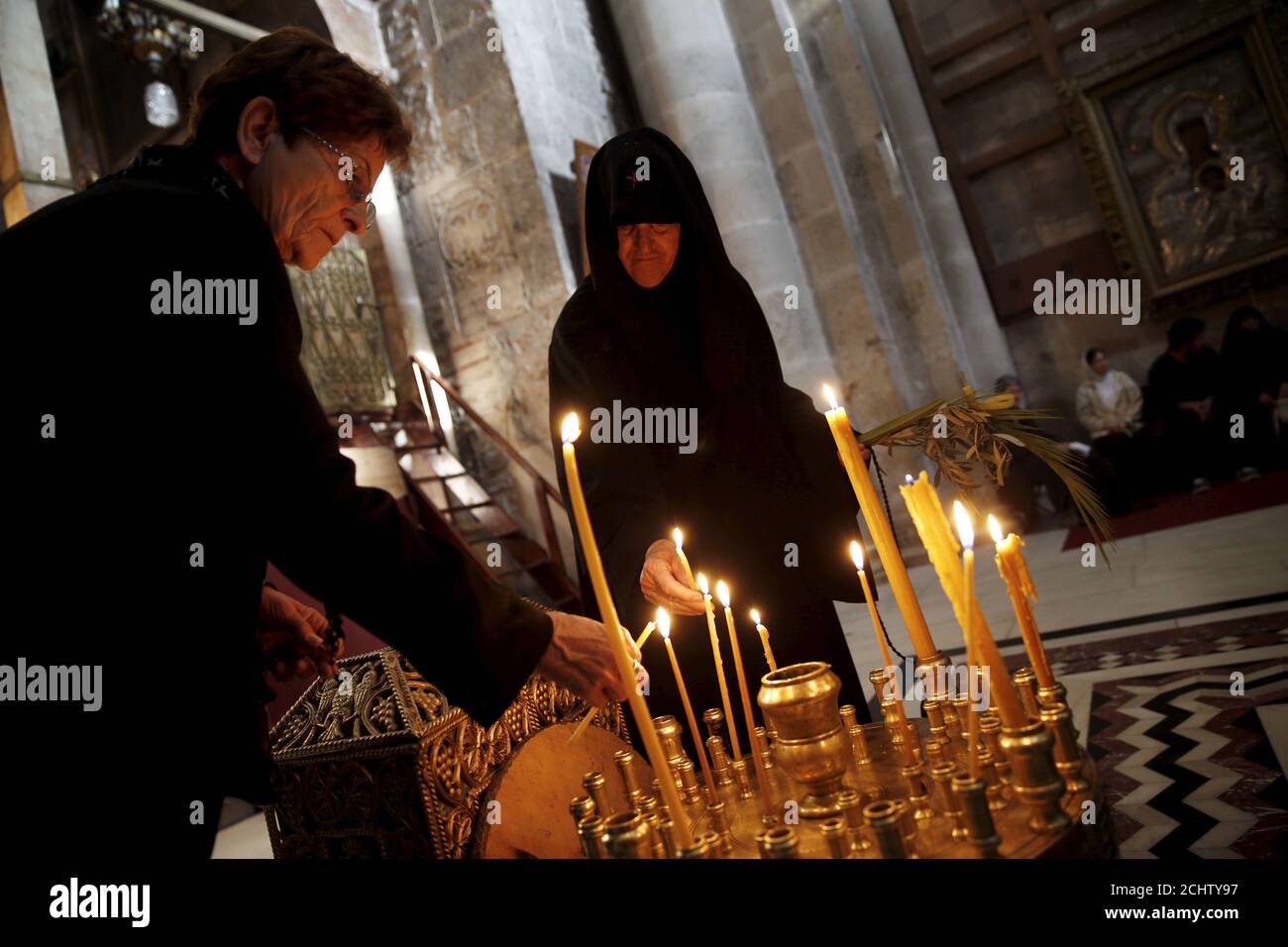 Candles nun hi-res stock photography and images - Alamy