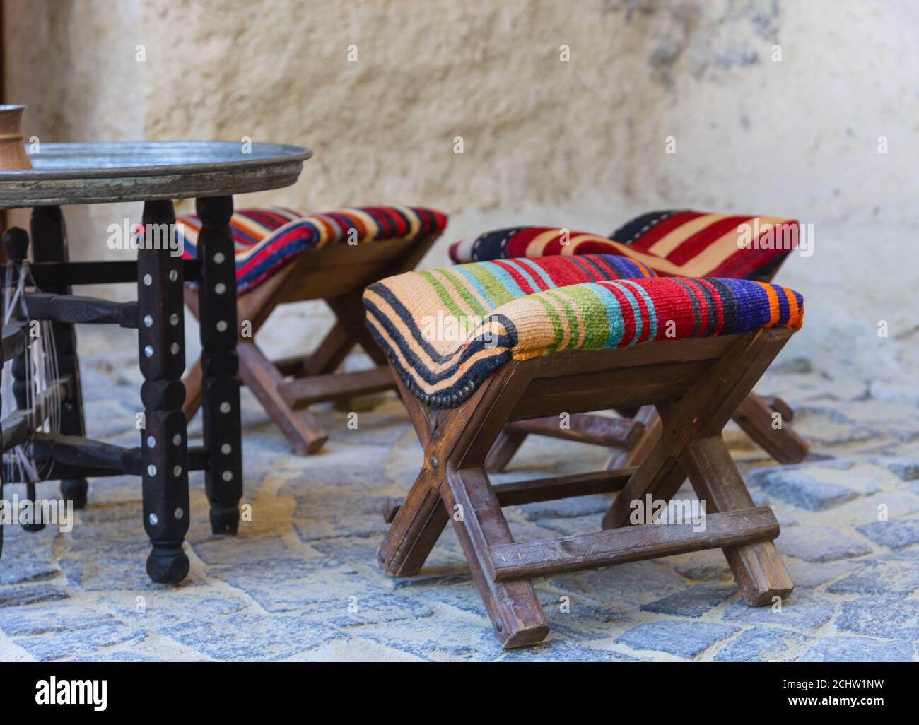 Turkish chairs and table outdoor with stoned wall at background Stock ...