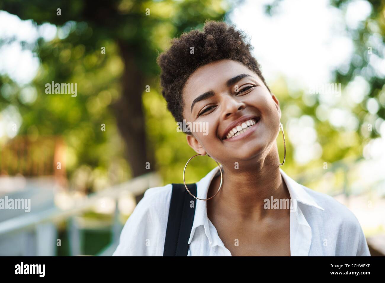 Photo Of Happy Positive Smiling African Woman Walking Outdoors In Park