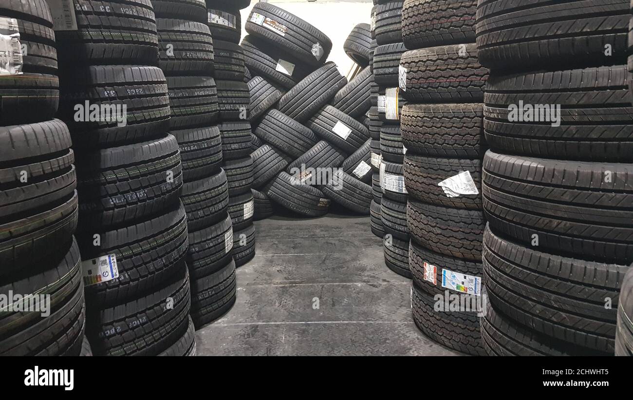 Car tyre warehouse Stock Photo - Alamy