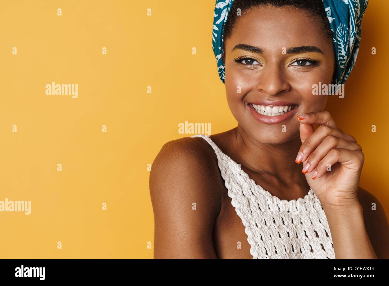 Image Of Funny African American Woman Posing And Smiling On Camera Isolated Yellow Background