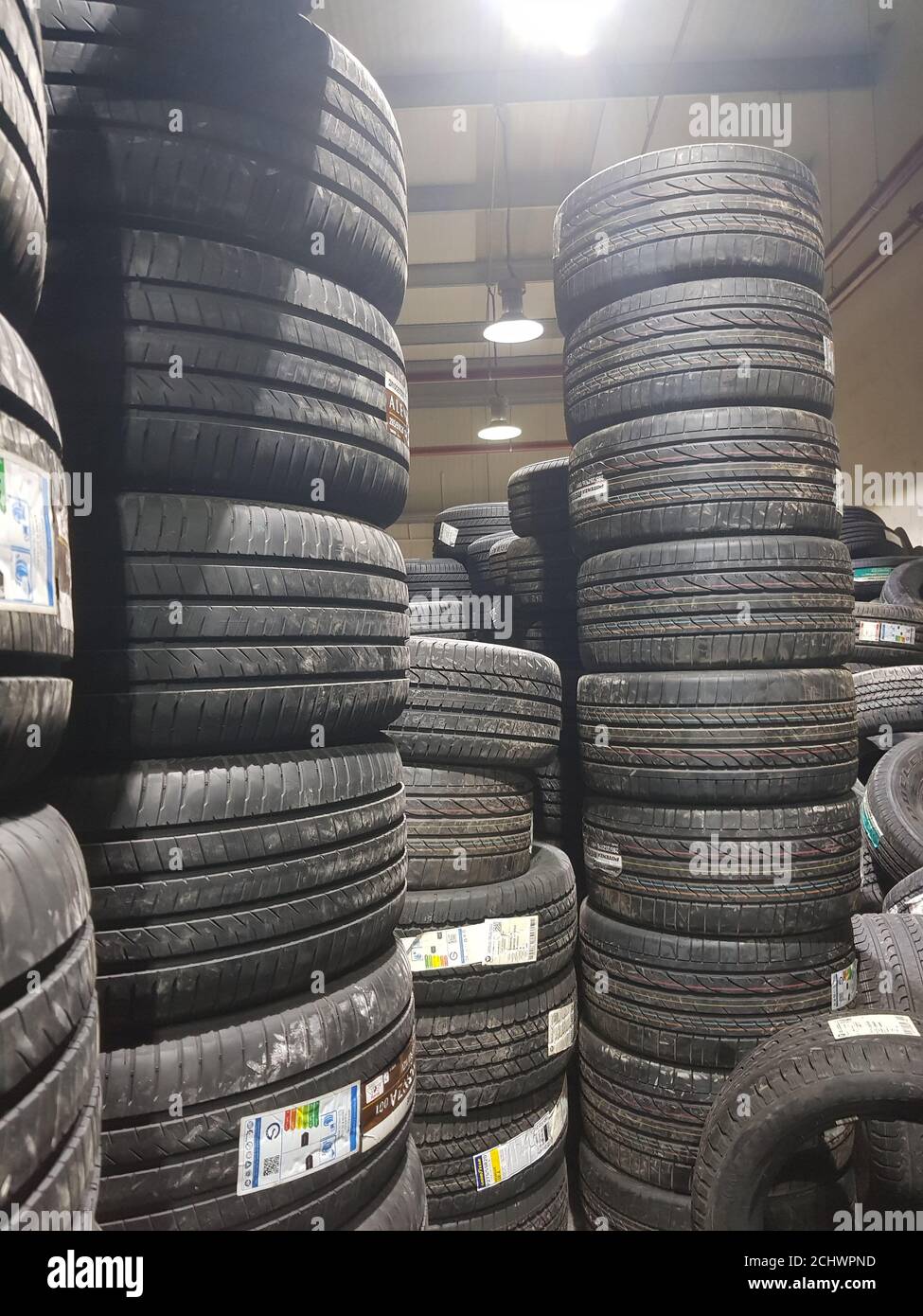 Car tyre warehouse Stock Photo - Alamy