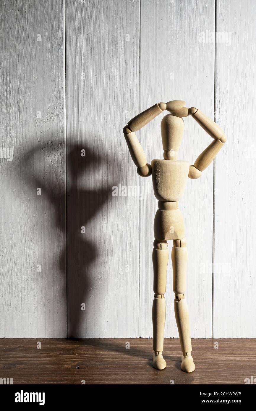 the wooden mannequin with raised arms Stock Photo - Alamy