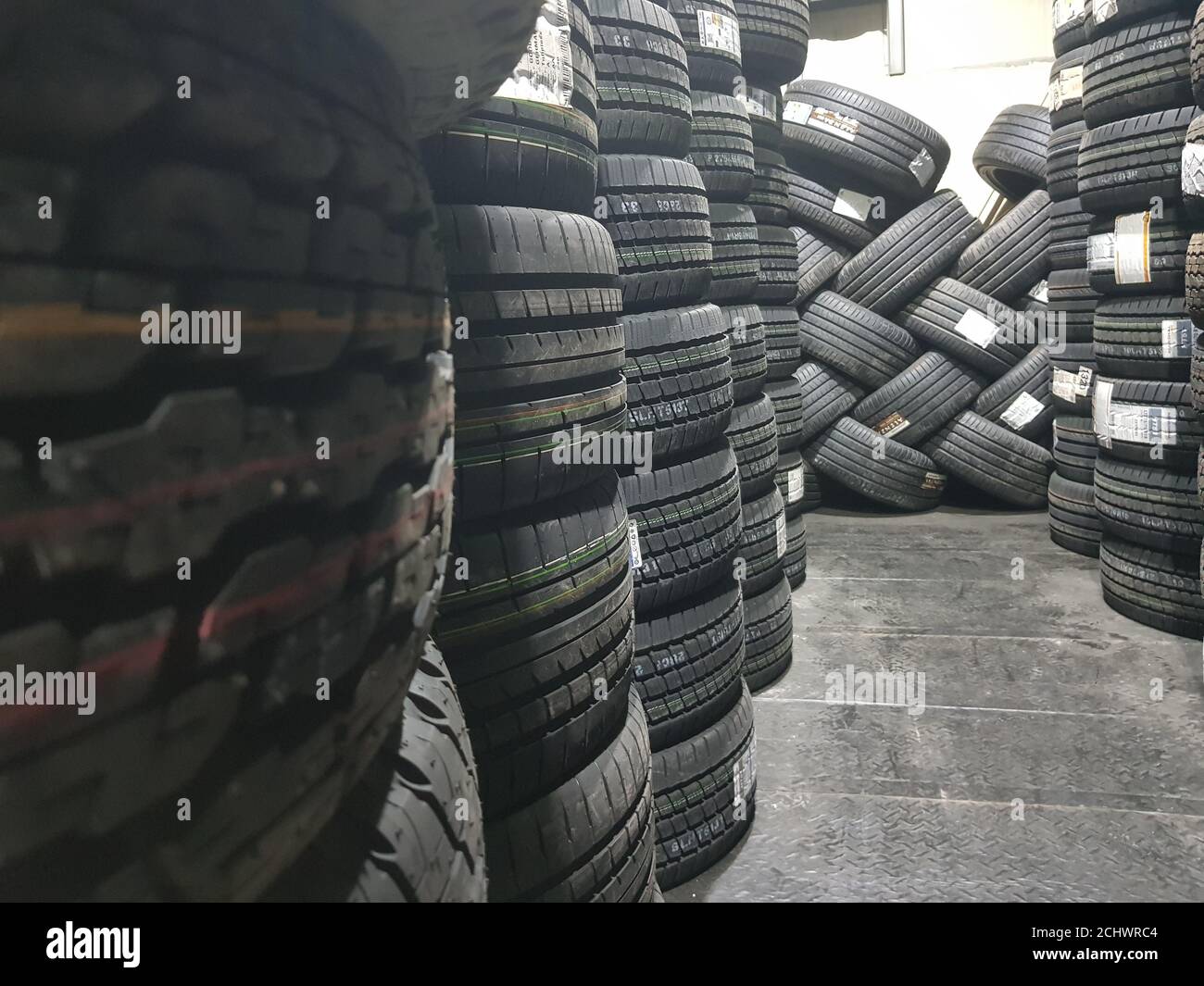 Car tyre warehouse Stock Photo - Alamy