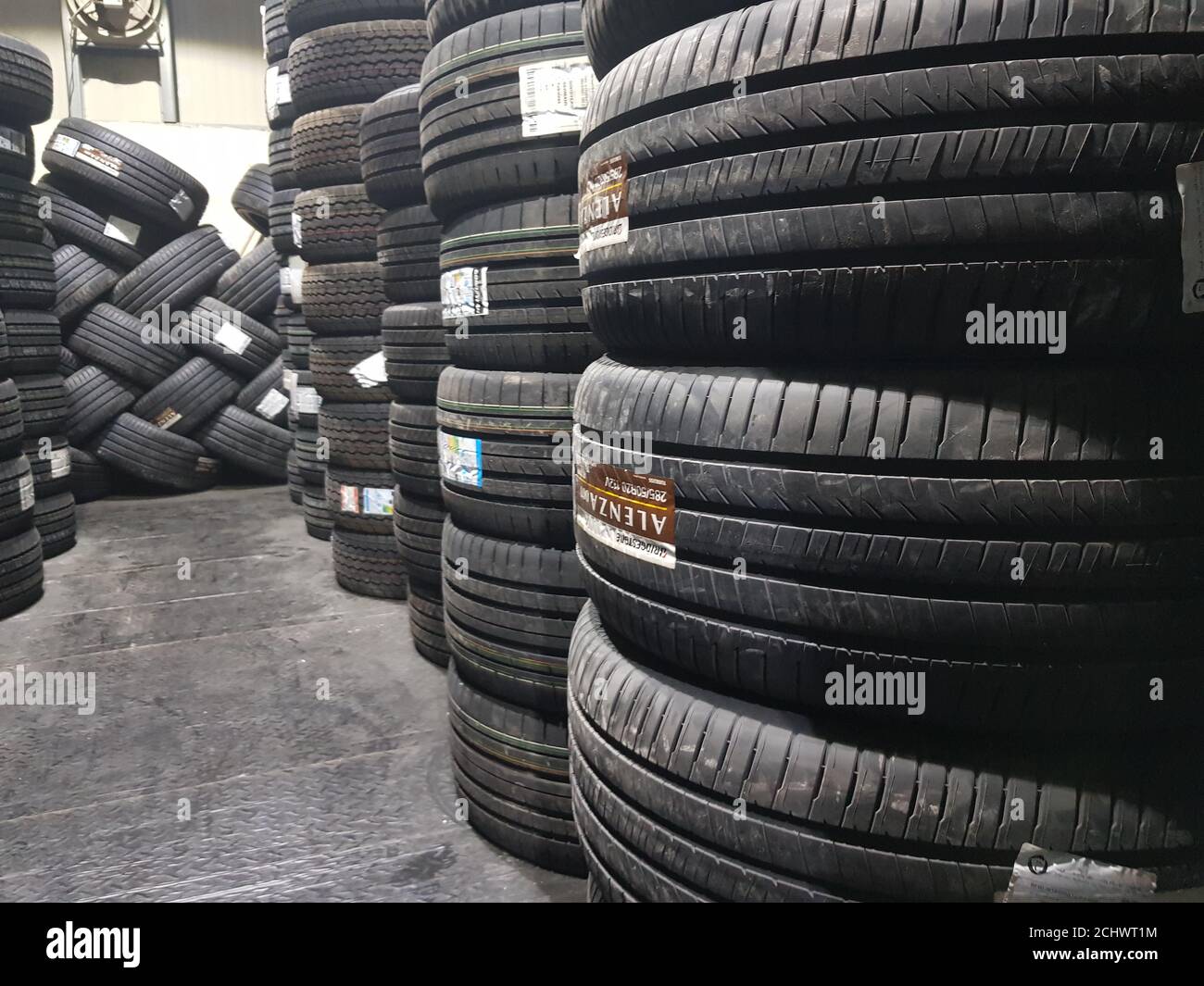Car tyre warehouse Stock Photo - Alamy
