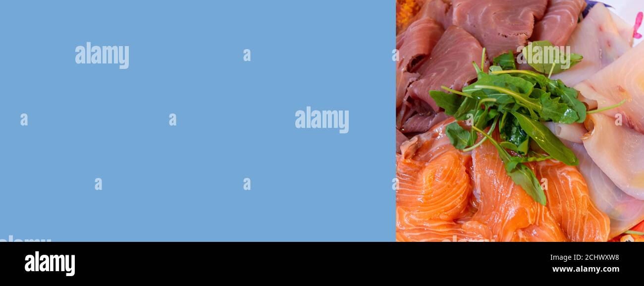 Seafood food isolated on light blue background with space for branding ...