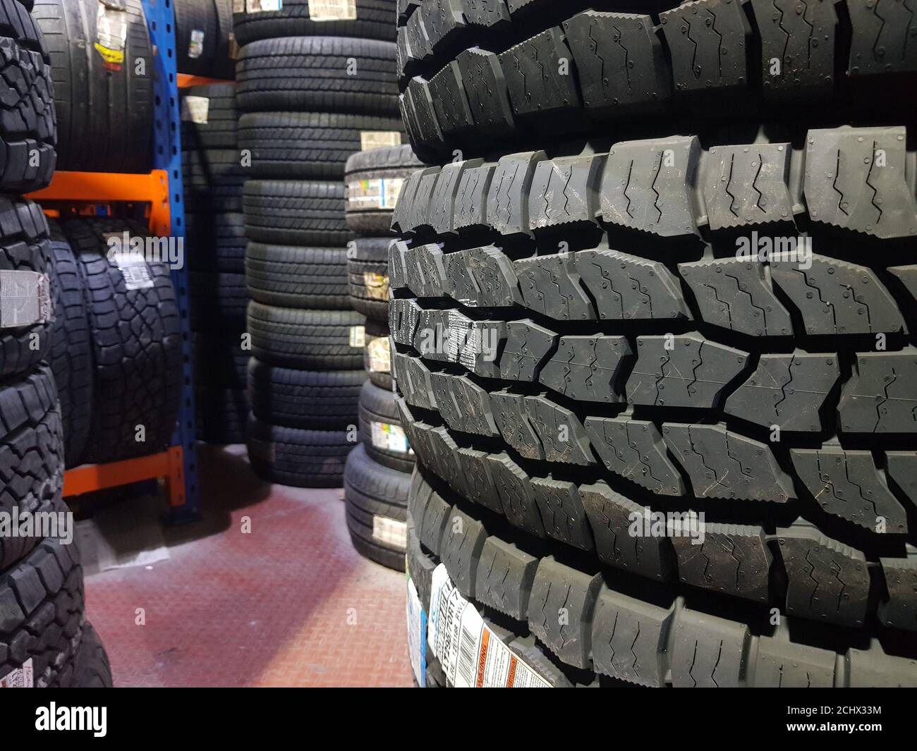 Car tyre warehouse Stock Photo - Alamy