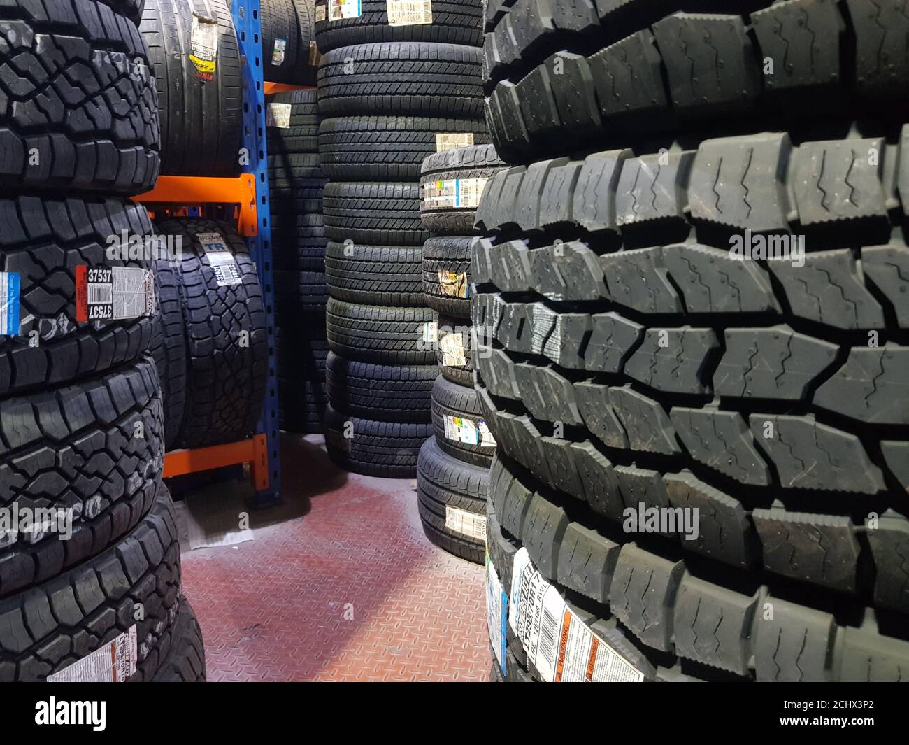 Car tyre warehouse Stock Photo - Alamy
