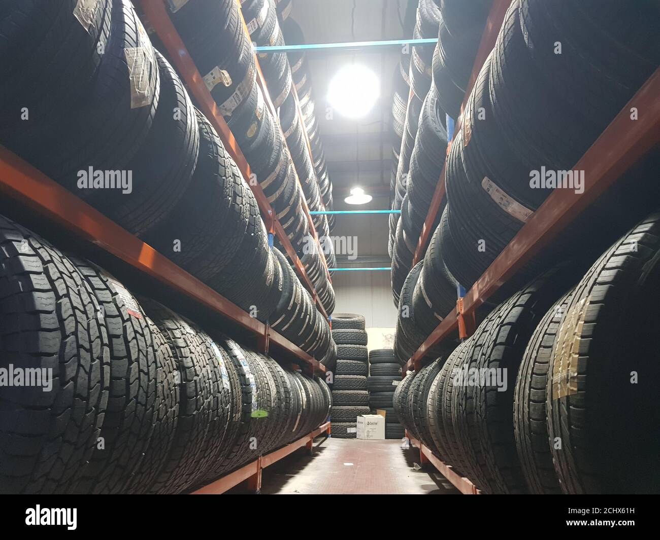 Car tyre warehouse Stock Photo - Alamy