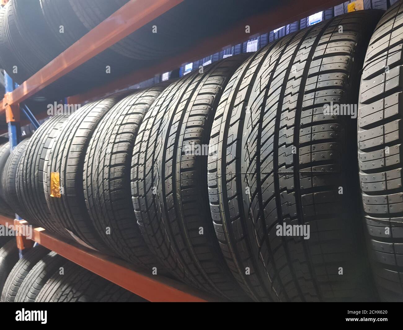 Car tyre warehouse Stock Photo - Alamy