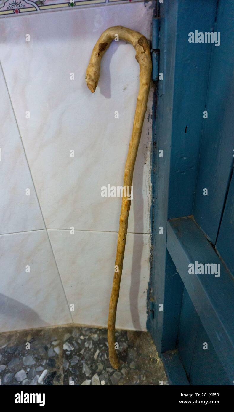 wooden walking stick leaning against the wall Stock Photo - Alamy