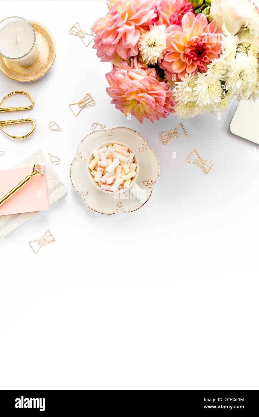 Flat lay home office desk. Female workspace with pink roses, dahlias ...