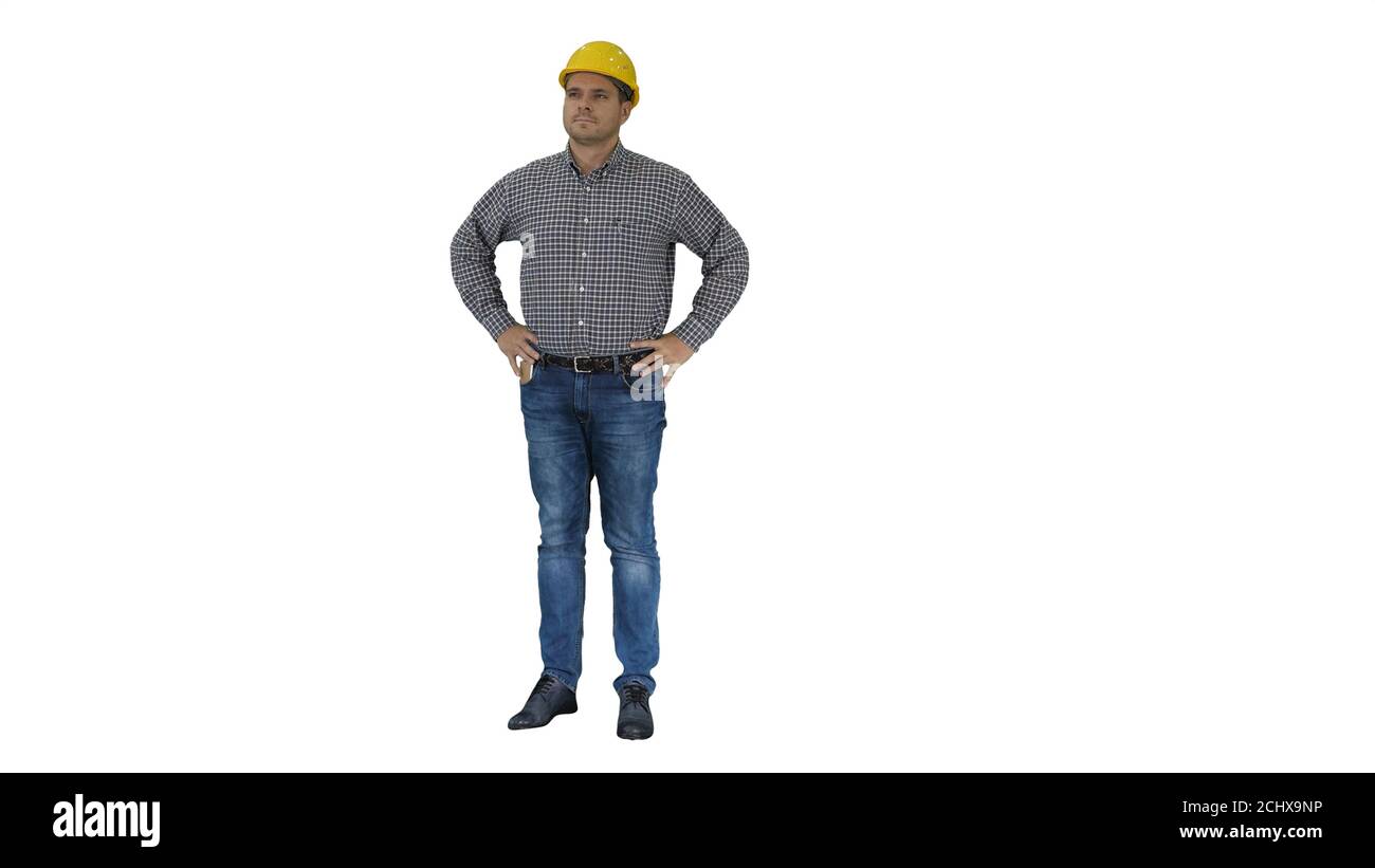 Smiling construction worker in yellow helmet looking at perfect well ...