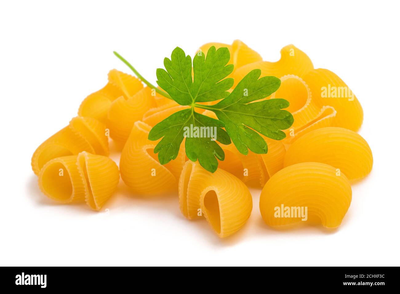 Pipe rigate pasta with parsley isolated on white background Stock Photo ...