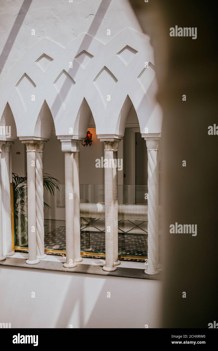 Vertical shot of arch windows on a balcony of a building Stock Photo ...