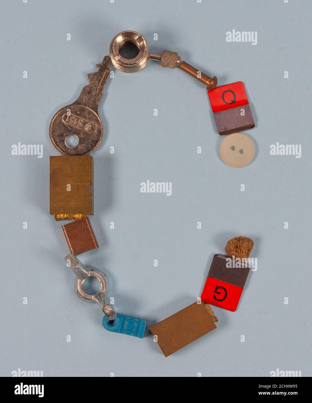 Letter of the alphabet constructed with small various objects on ...