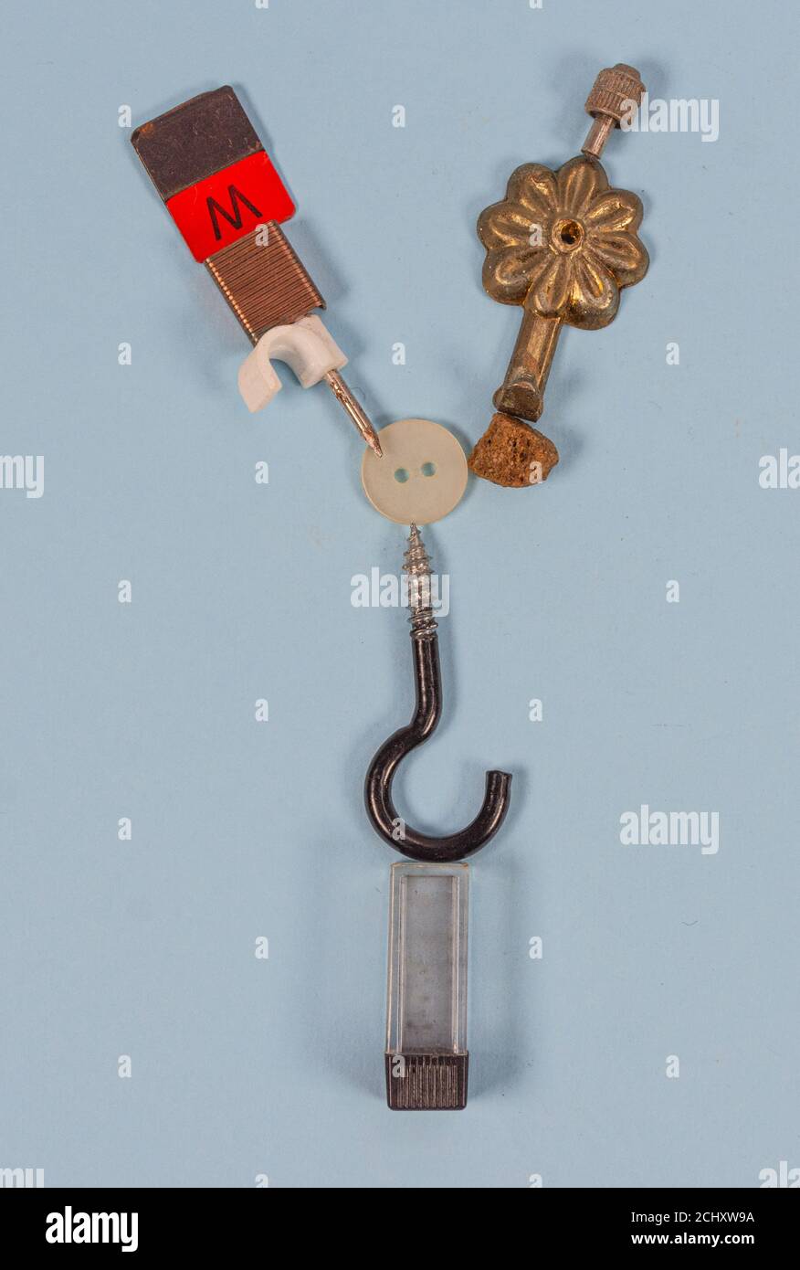 Letter of the alphabet constructed with small various objects on ...