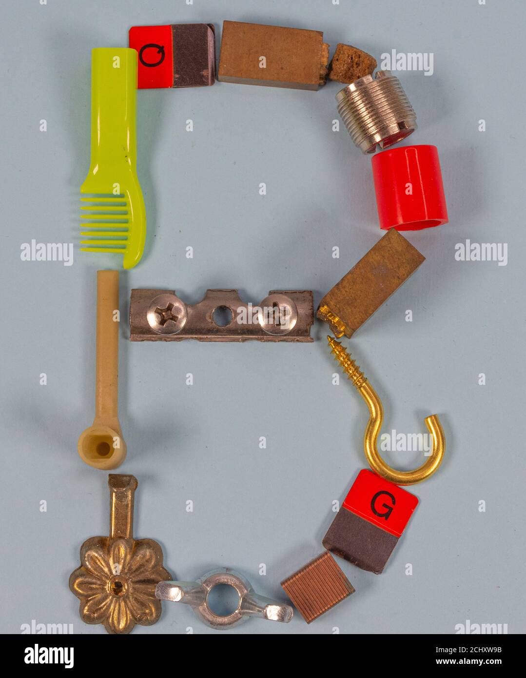 Letter of the alphabet constructed with small various objects on ...