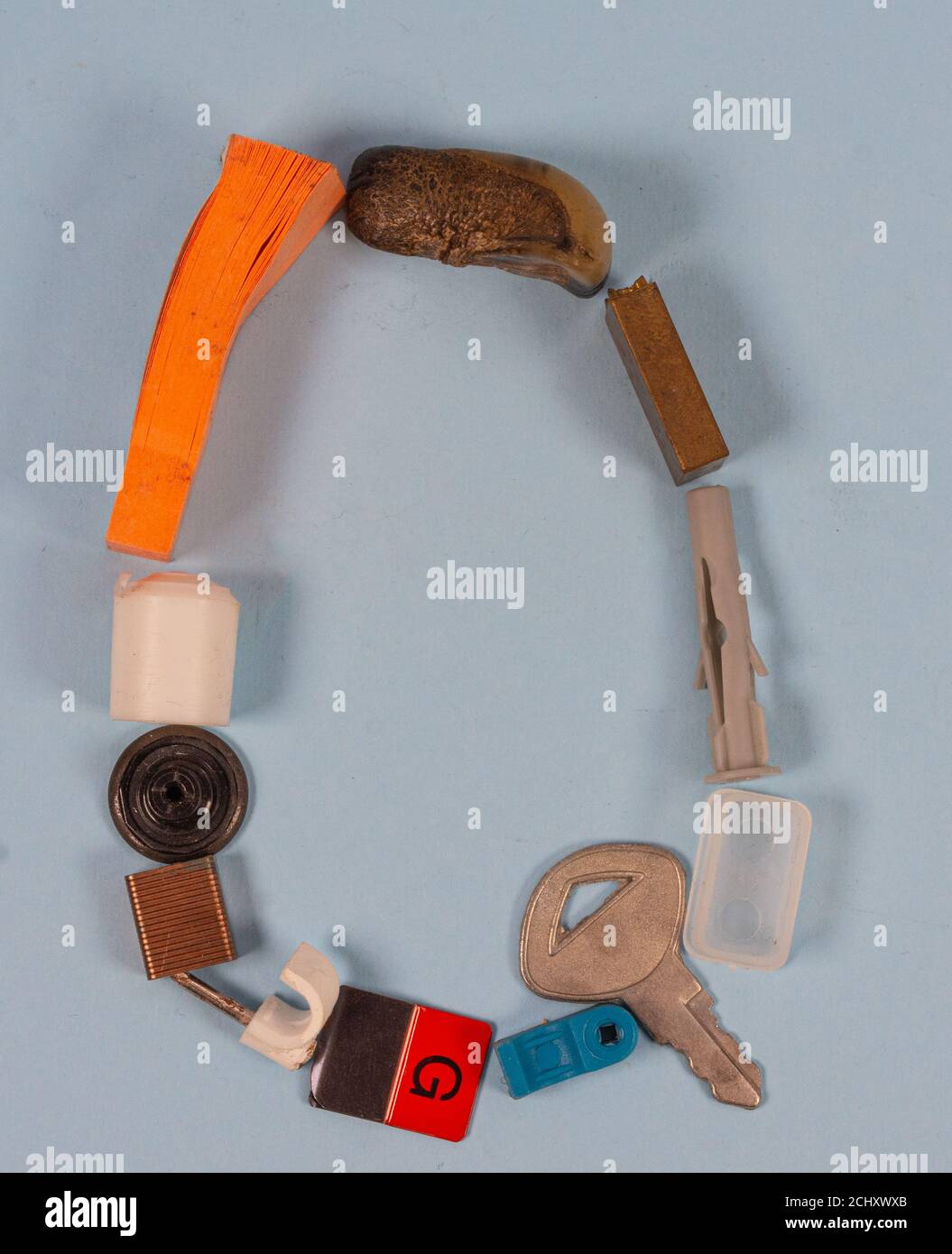 Letter of the alphabet constructed with small various objects on ...