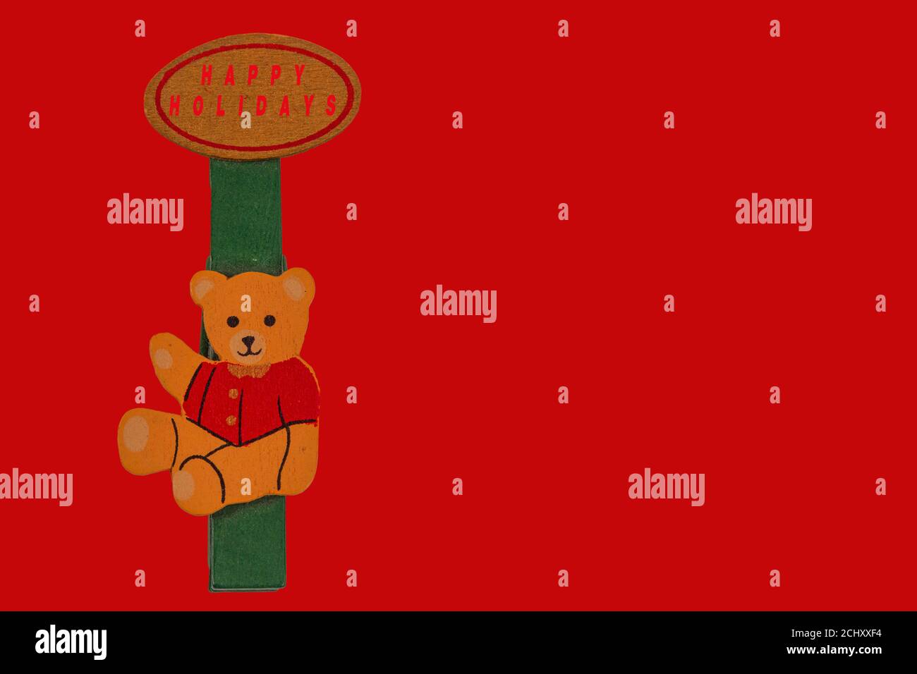 Teddy bear holding sign with lettering isolated on red background Stock ...