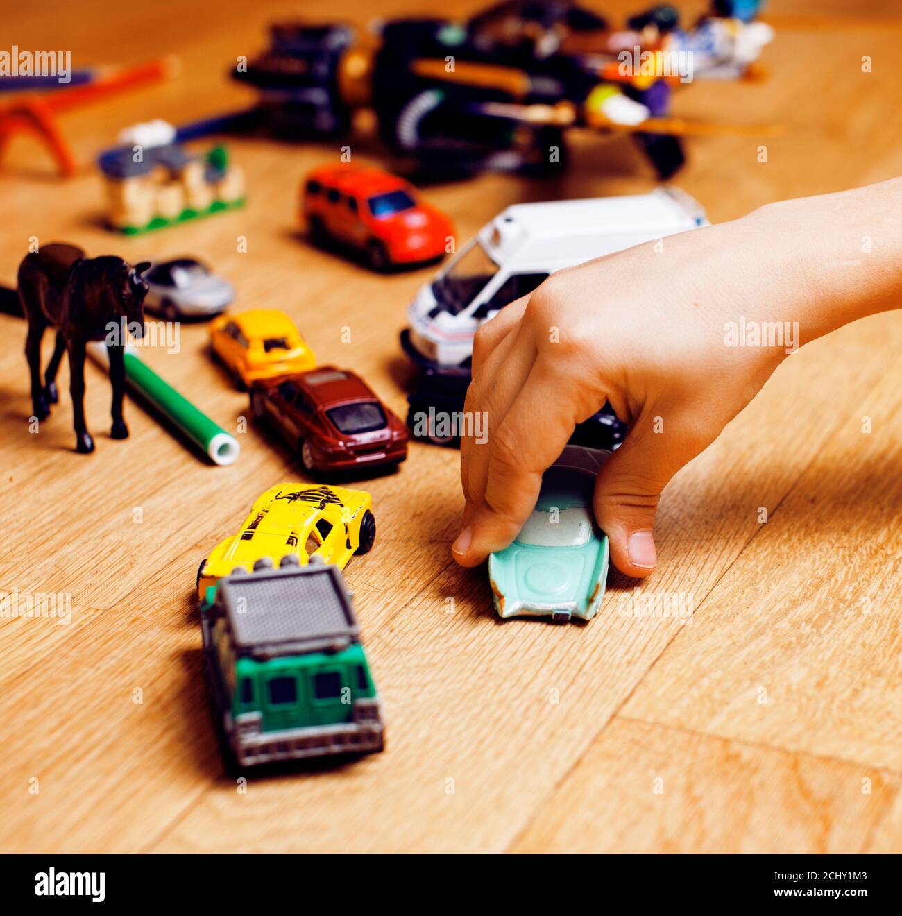 children playing toys on floor at home, little hand in mess, free ...