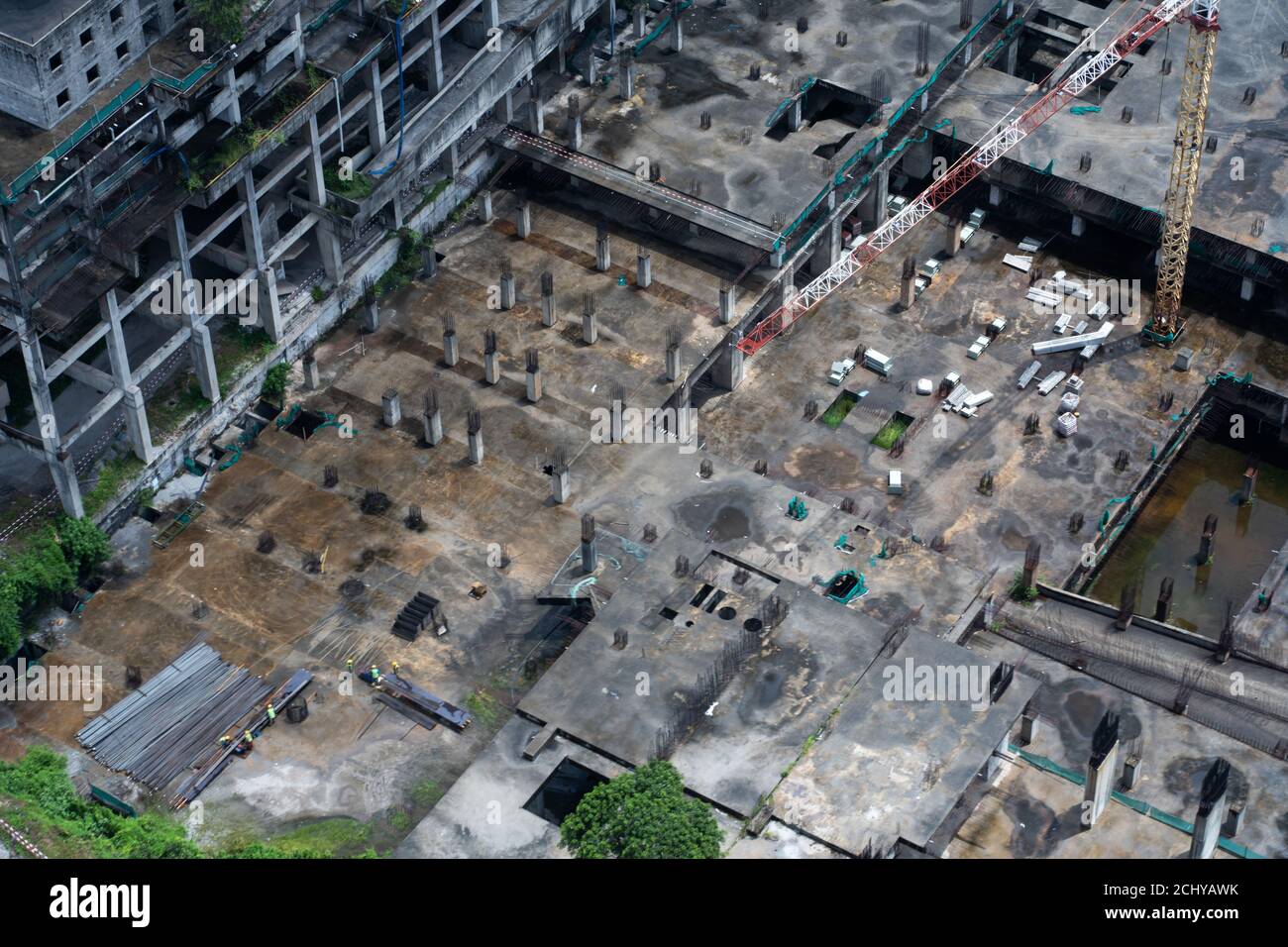 Top view of the construction site of a large building after rain. Piles ...