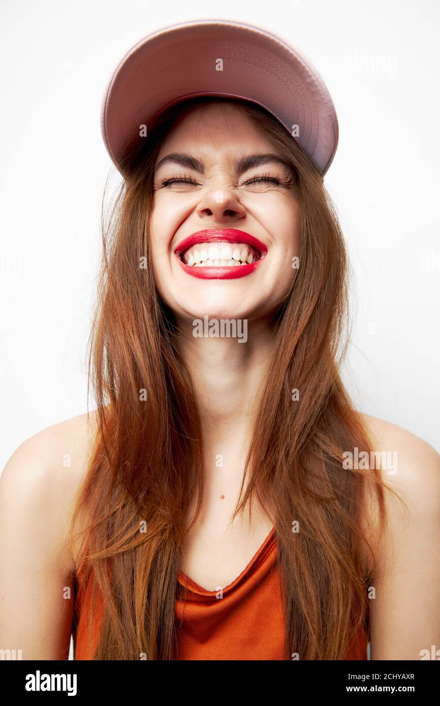 Beautiful woman in a cap Model wide smile closed eyes fashionable ...