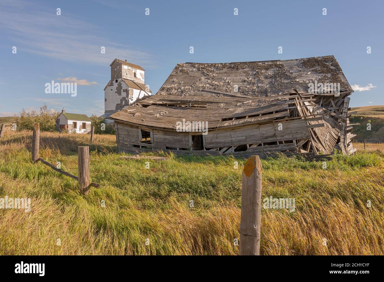 Abandoned barn and grain elevator at Sharples, Alberta, Canada Stock ...