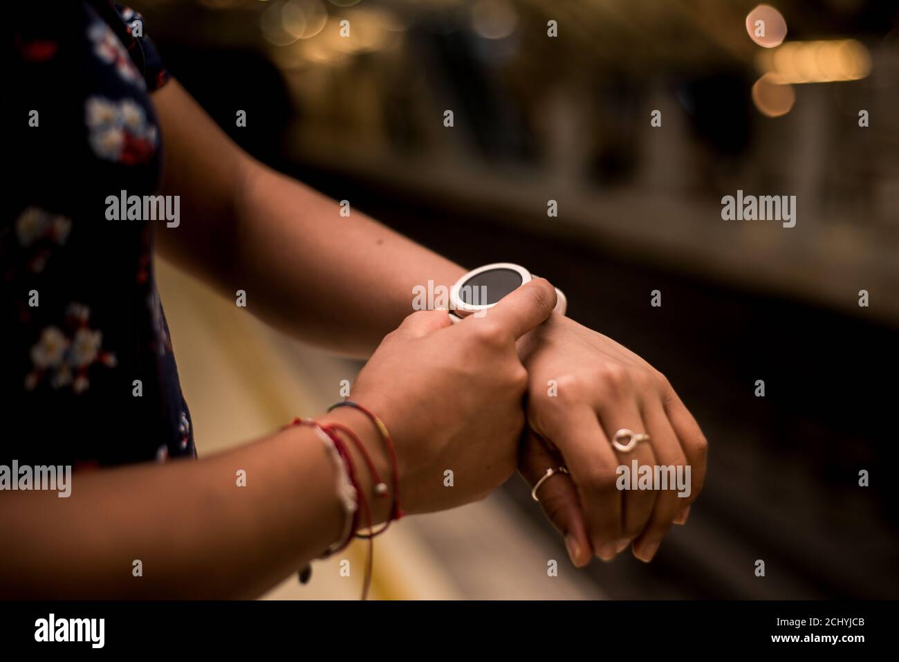 Adjusting her watch hi-res stock photography and images - Alamy