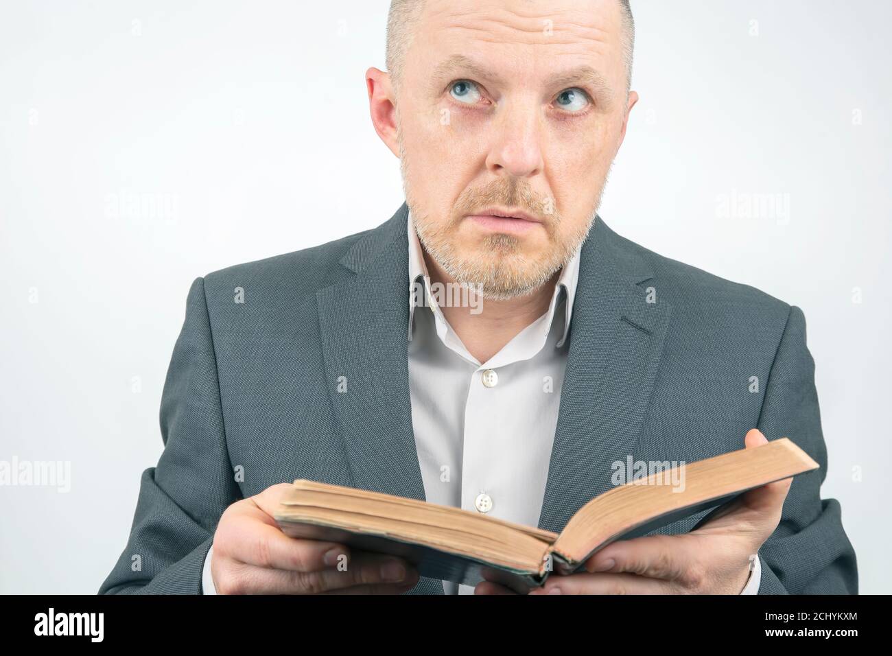 Man in suit holding bible hi-res stock photography and images - Alamy