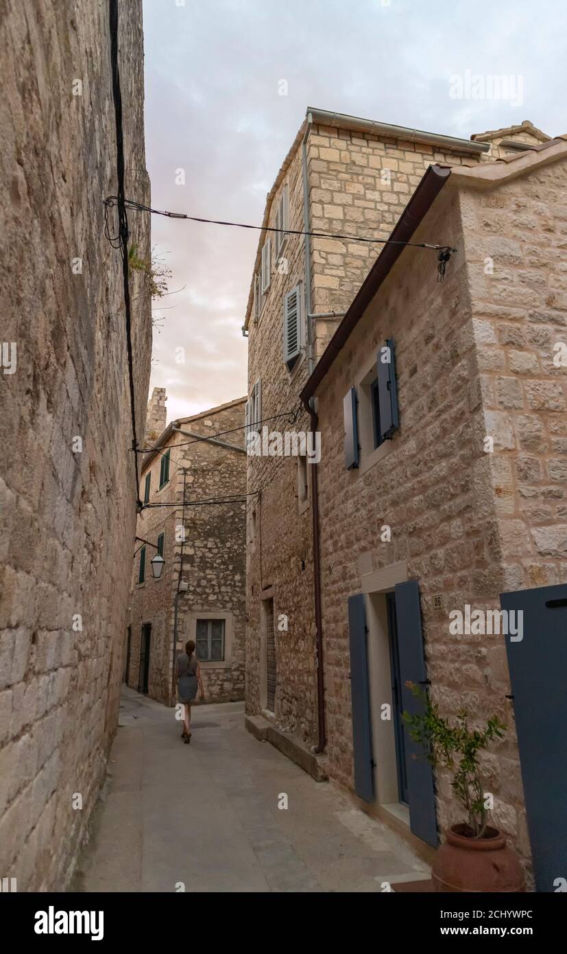 Beautiful, narrow streets of Hvar island with numerous houses, all made ...