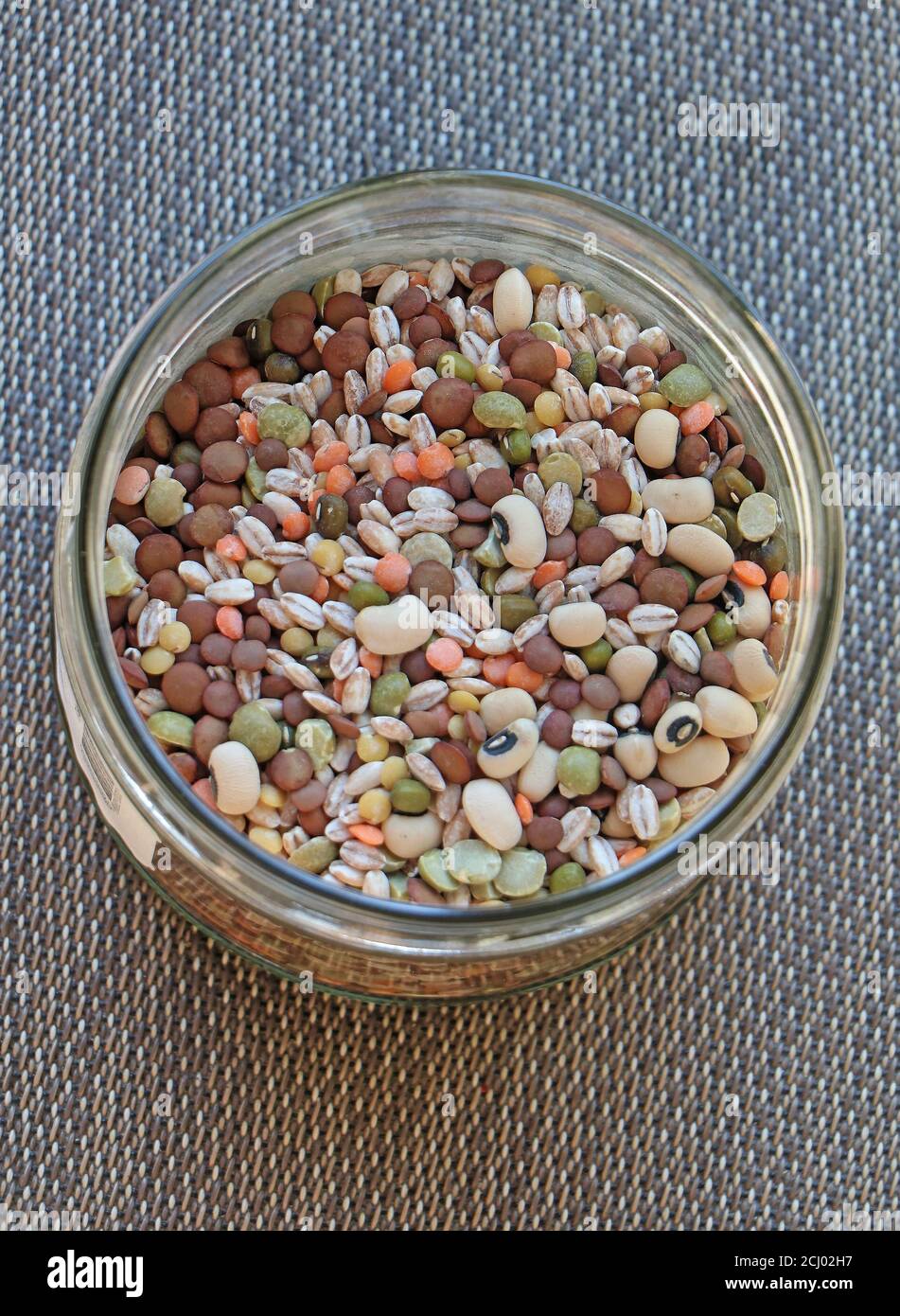Colorful organic lentils inside open glass jar Stock Photo - Alamy