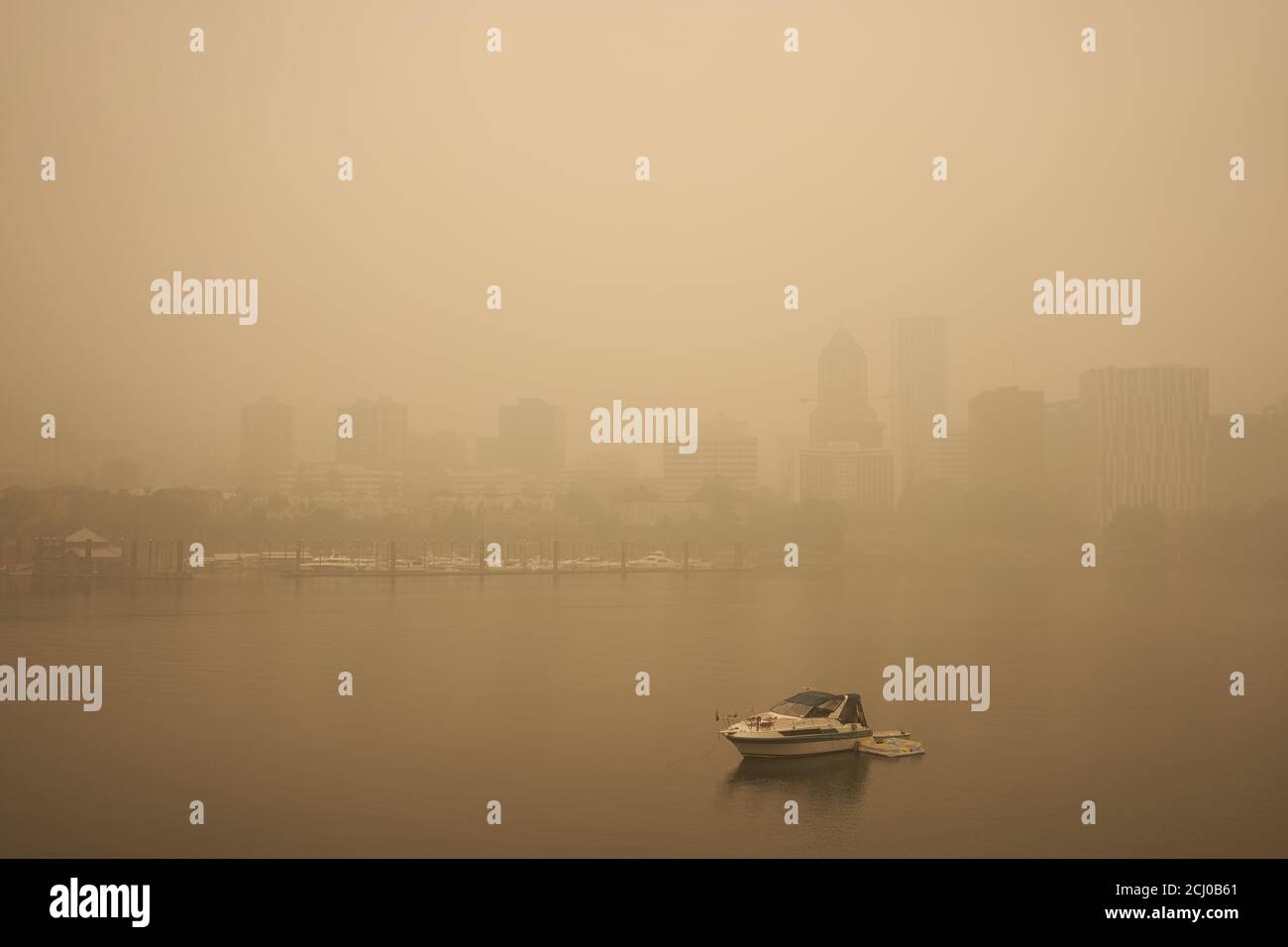 An orange smoke-filled sky is seen above Portland's downtown skyline on ...
