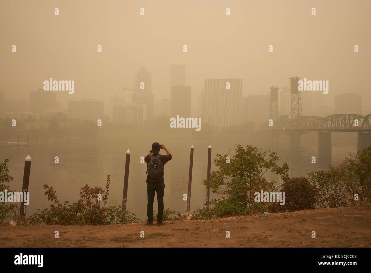 An orange smoke-filled sky is seen above Portland's downtown skyline on ...