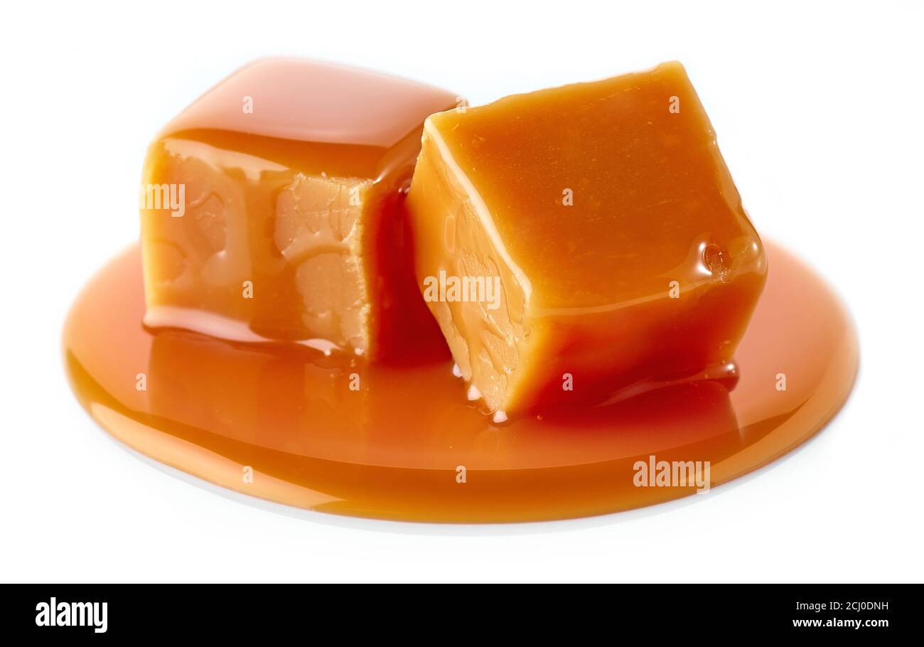 two caramel candies isolated on white background Stock Photo - Alamy