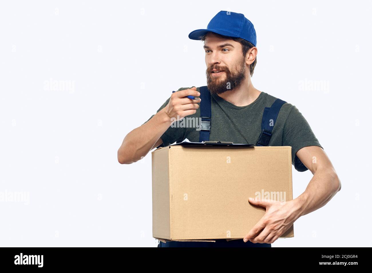 Working male courier with box in hand documents delivery service light ...