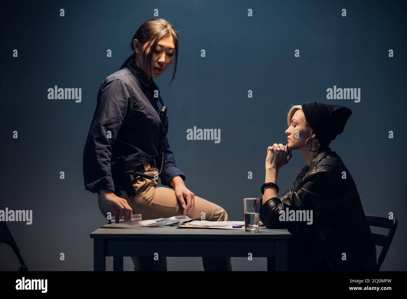 A young investigator an asian woman sits on a table during the ...