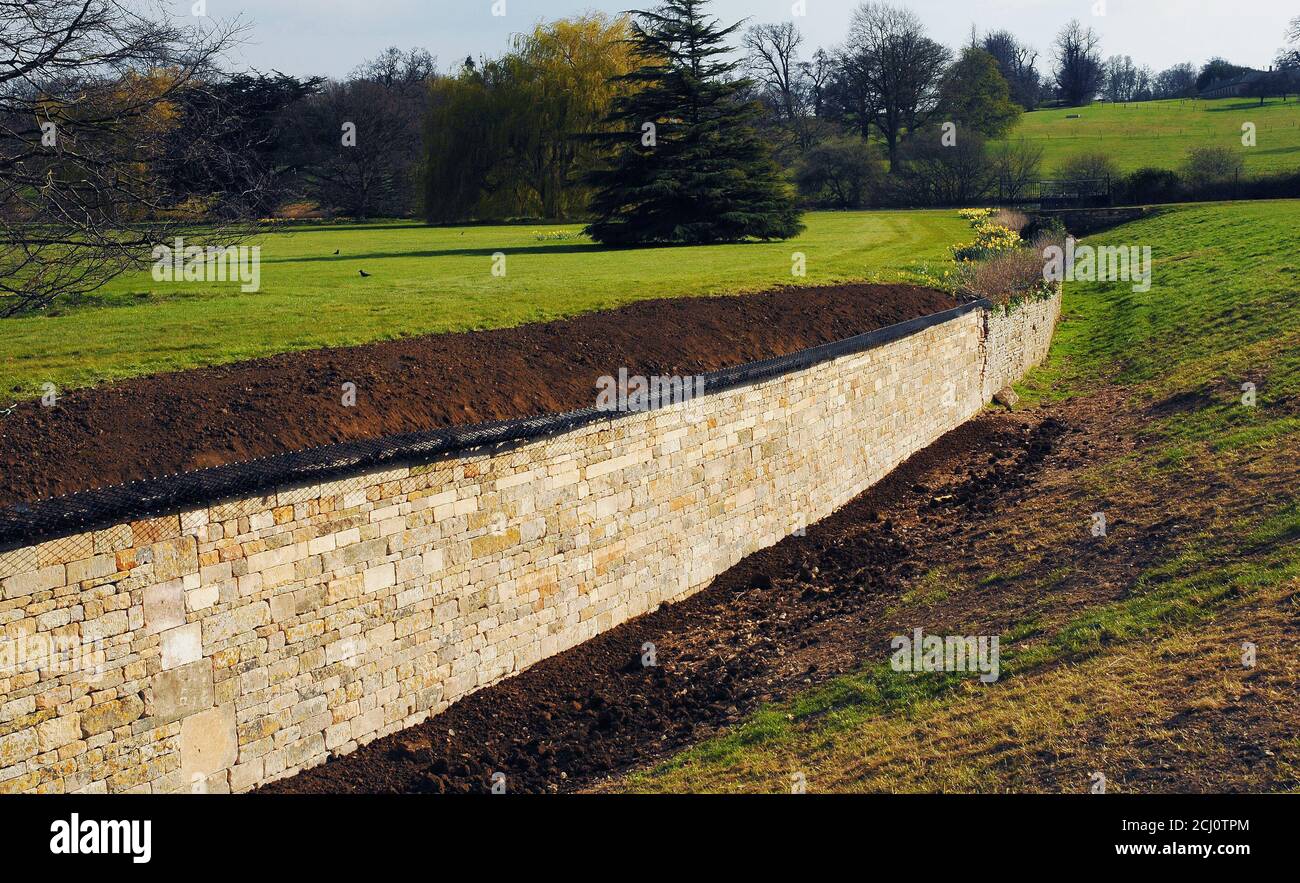 The 18C Capability Brown stone ha-ha newly restored Stock Photo - Alamy