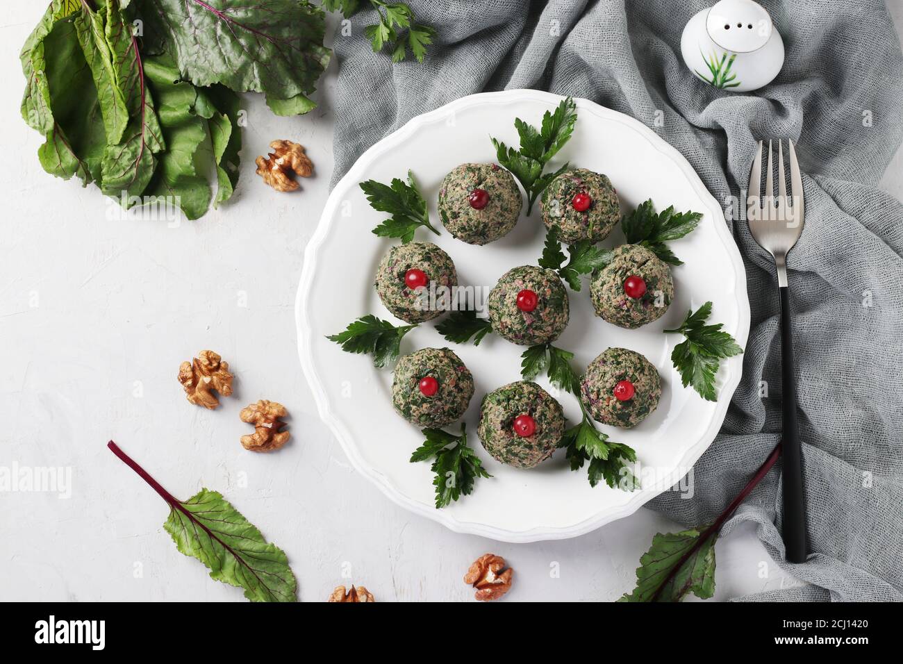 Traditional Georgian appetizer pkhali from beet tops on light gray ...