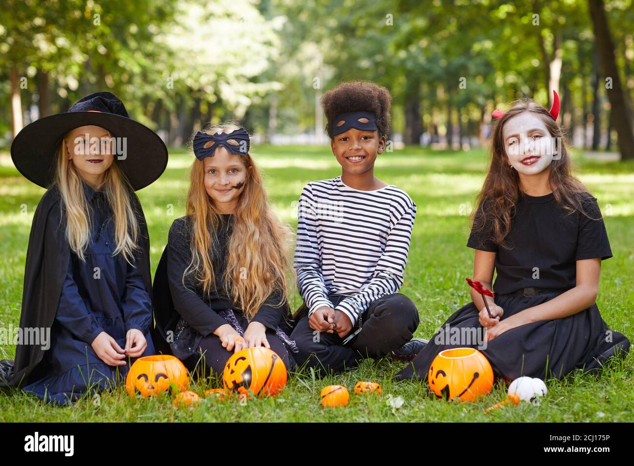 Full length portrait of multi-ethnic group of children wearing ...