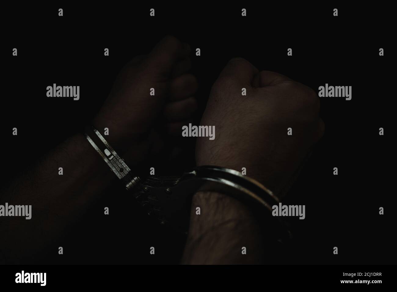 Handcuffed Arms High Resolution Stock Photography and Images - Alamy