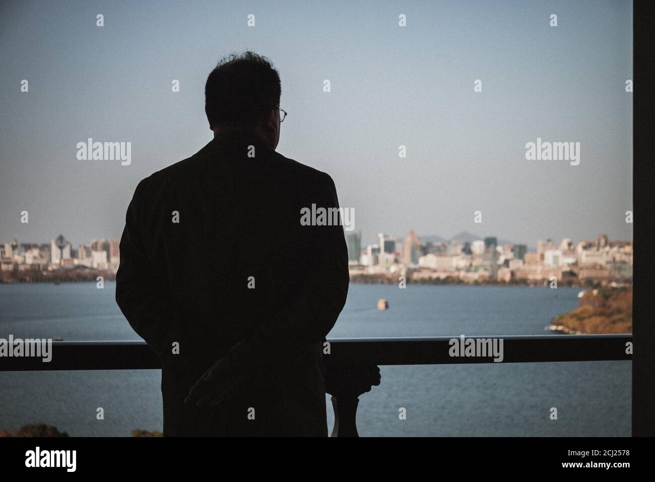 Closeup focus shot of a man overlooking the city Stock Photo - Alamy