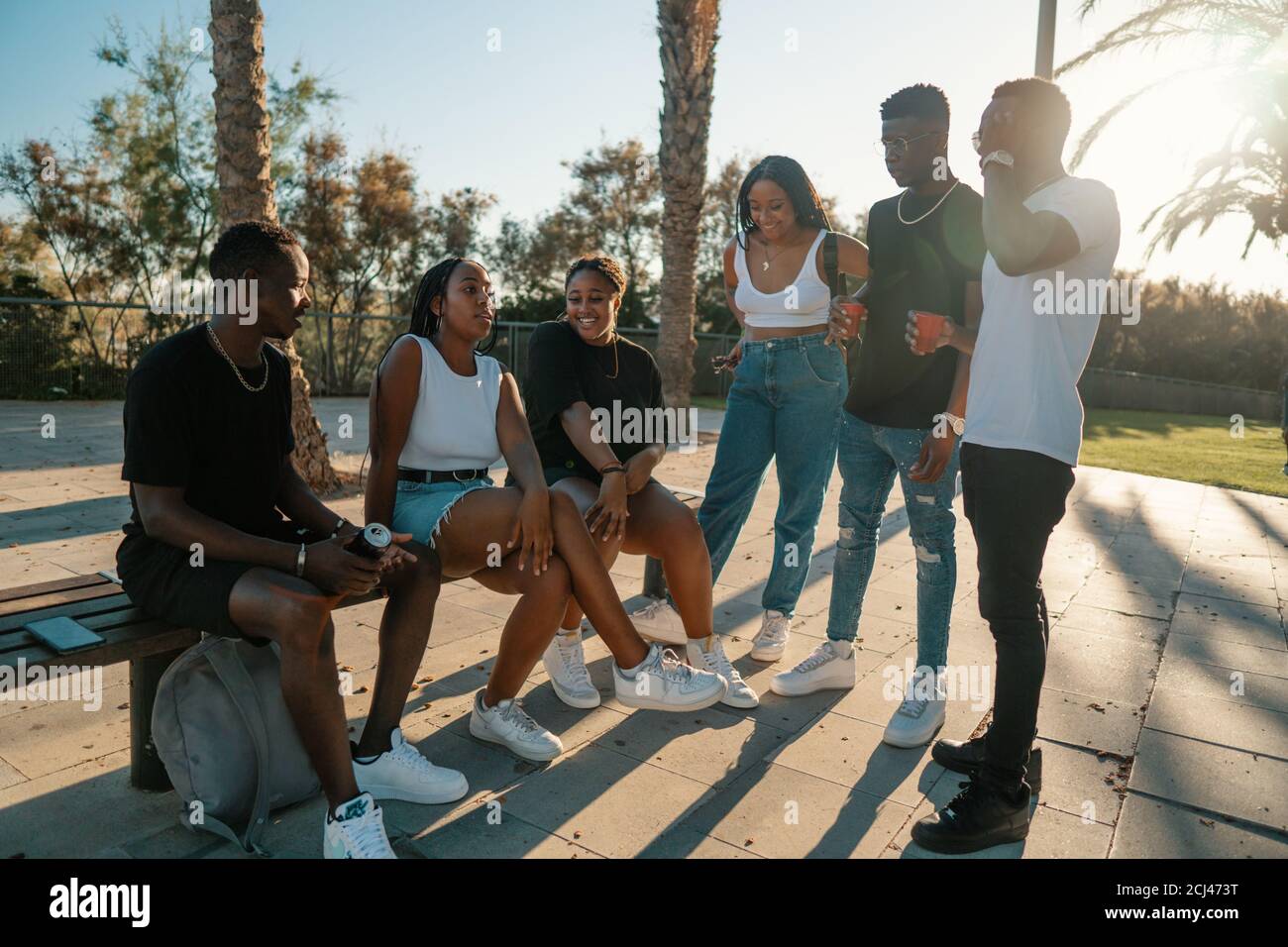 Group of young modern african black friends happily sitting together ...