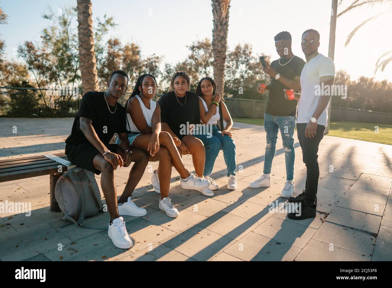 Group of young modern african black friends happily sitting together ...