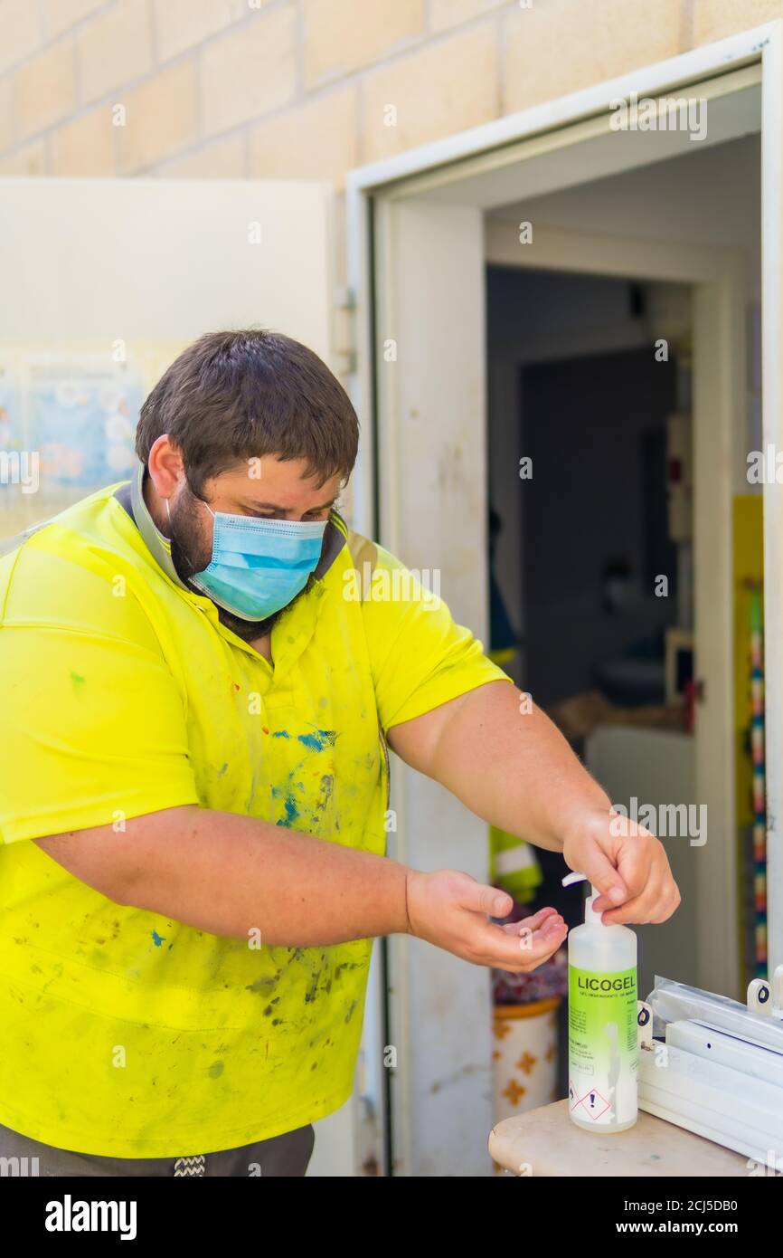 Cleaner working in a mask - the concept of "the new normal Stock Photo ...