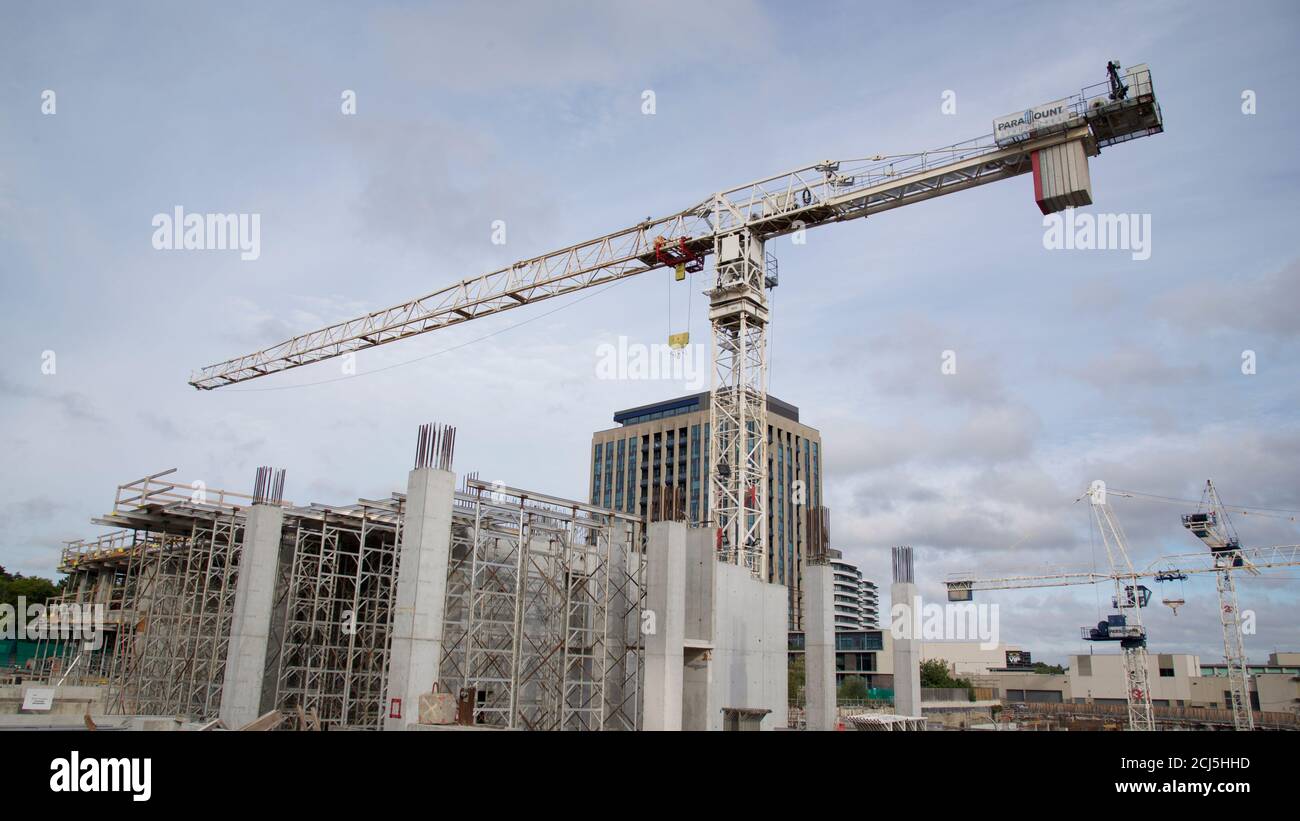 Cranes over the construction site with a blue sky background Stock ...