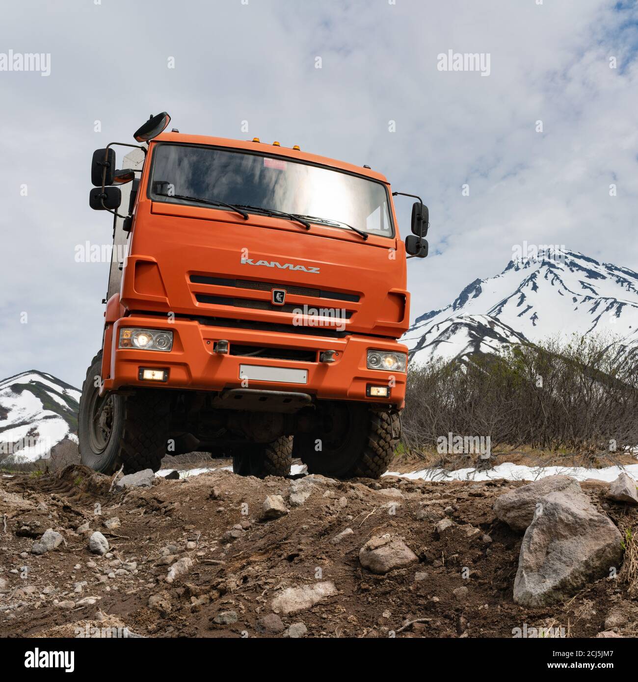 Russian off-road expedition passenger truck KamAZ on mountain road on ...